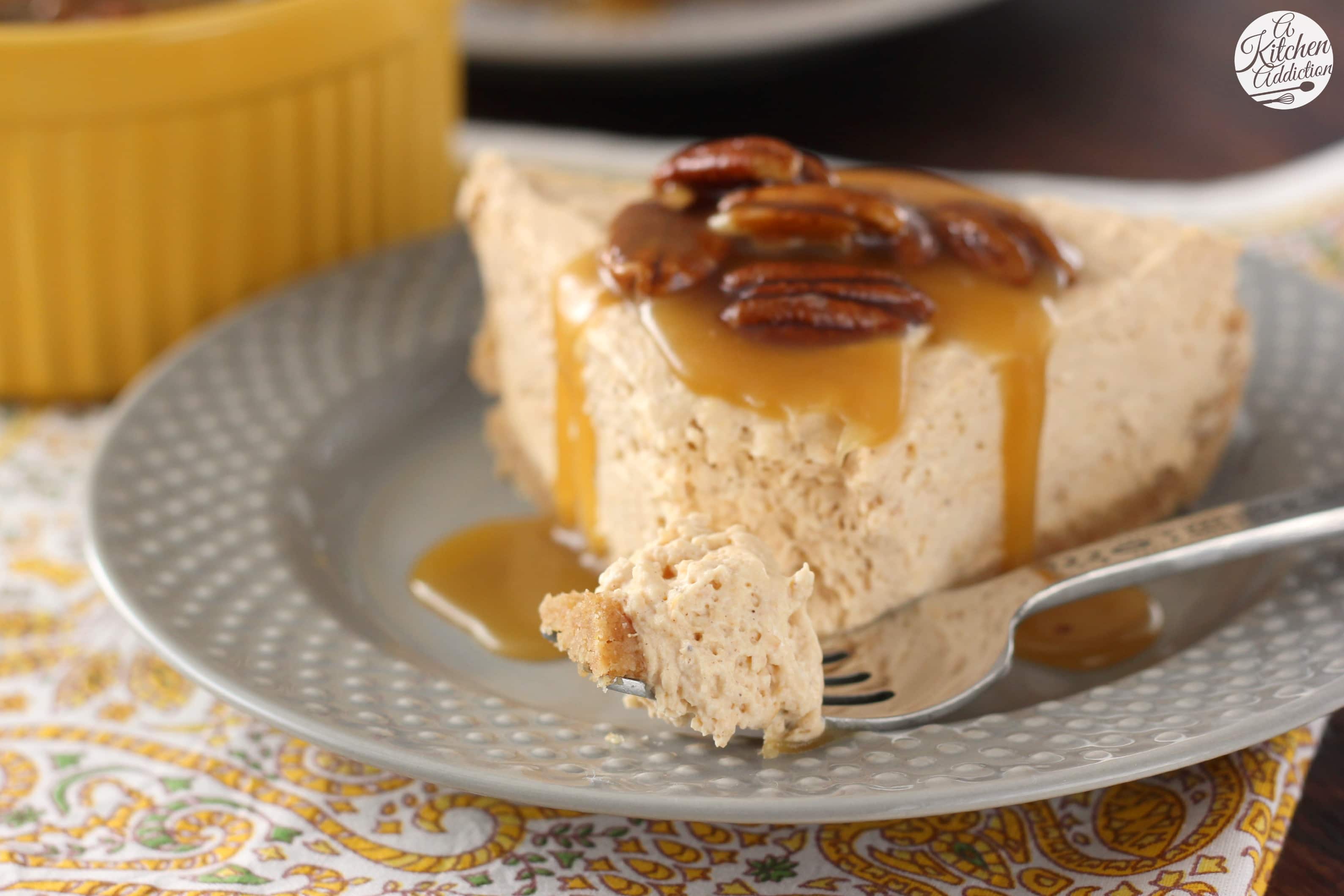 Maple Pumpkin Cheesecake with Pecan Praline Topping - A Kitchen Addiction